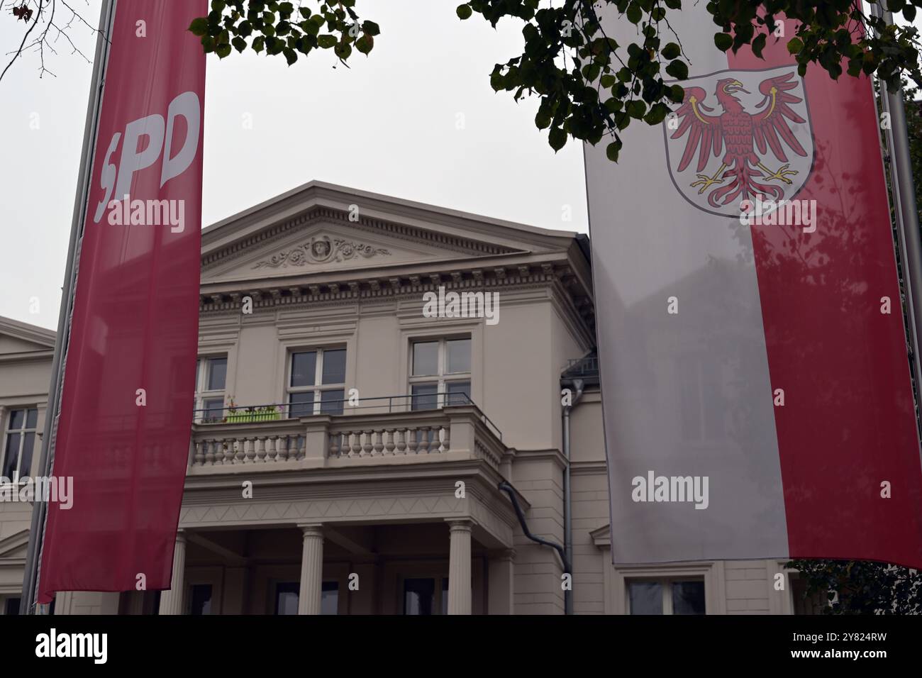 Potsdam, Germany. 02nd Oct, 2024. Flags of the SPD and Brandenburg fly ...