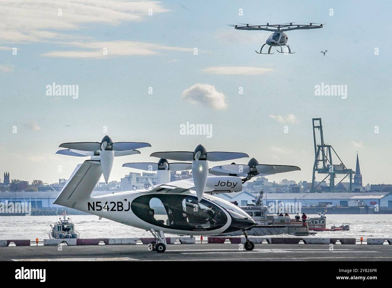 FILE - An electric vertical takeoff and landing (eVTOL) aircraft, flies ...