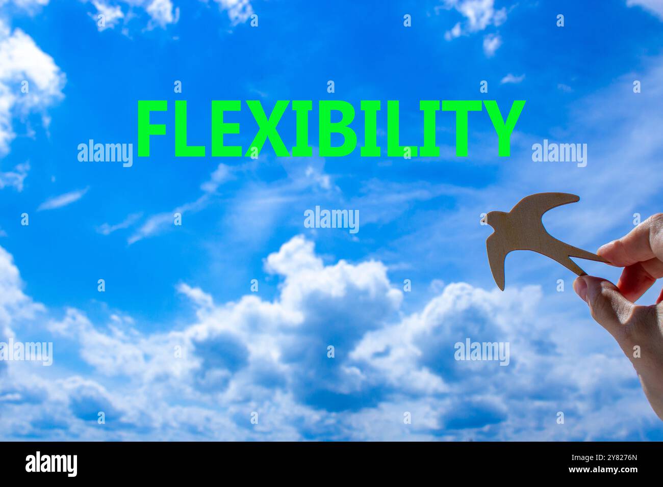 Flexibility symbol. Concept word Flexibility on beautiful blue sky ...