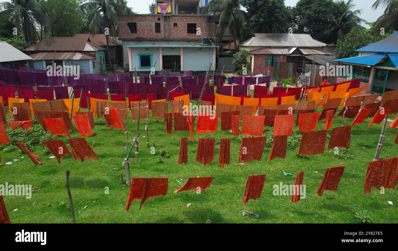 Fabrics drying under the sun above water hyacinths, Dhaka Division ...
