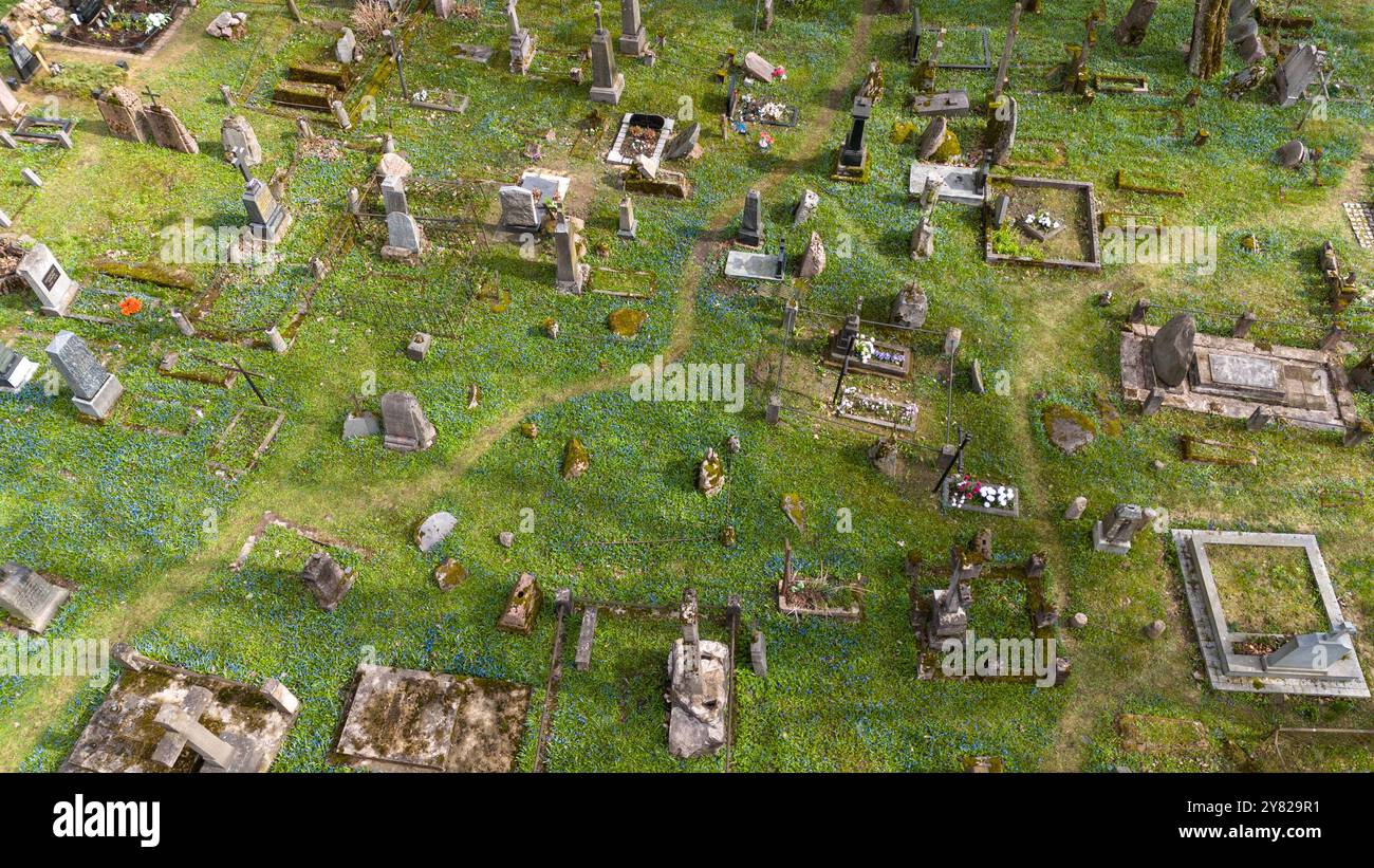 Aerial view of a cemetery with numerous gravestones and memorials ...