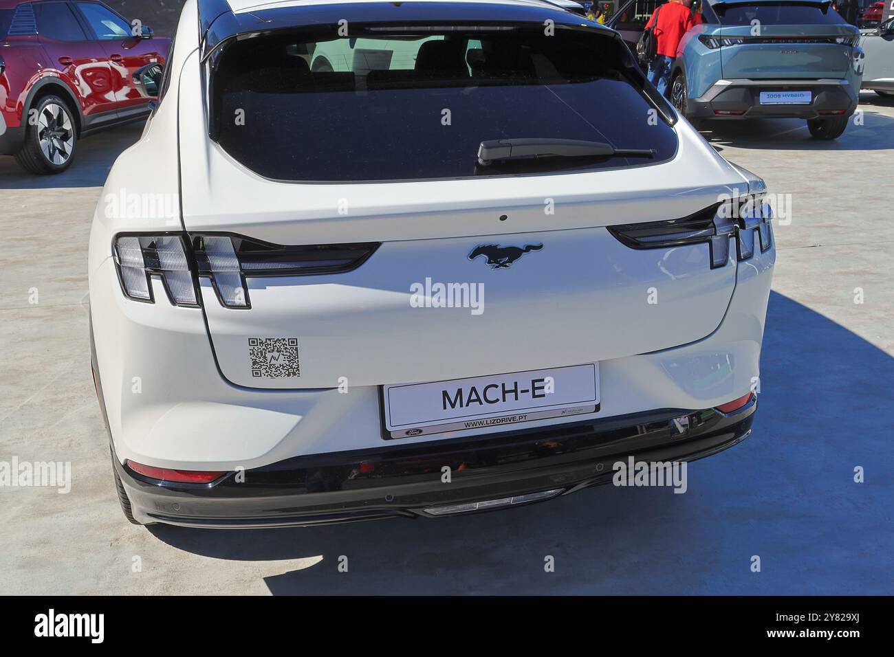 Rear view of a white ford mustang mach e electric car, showcasing its ...