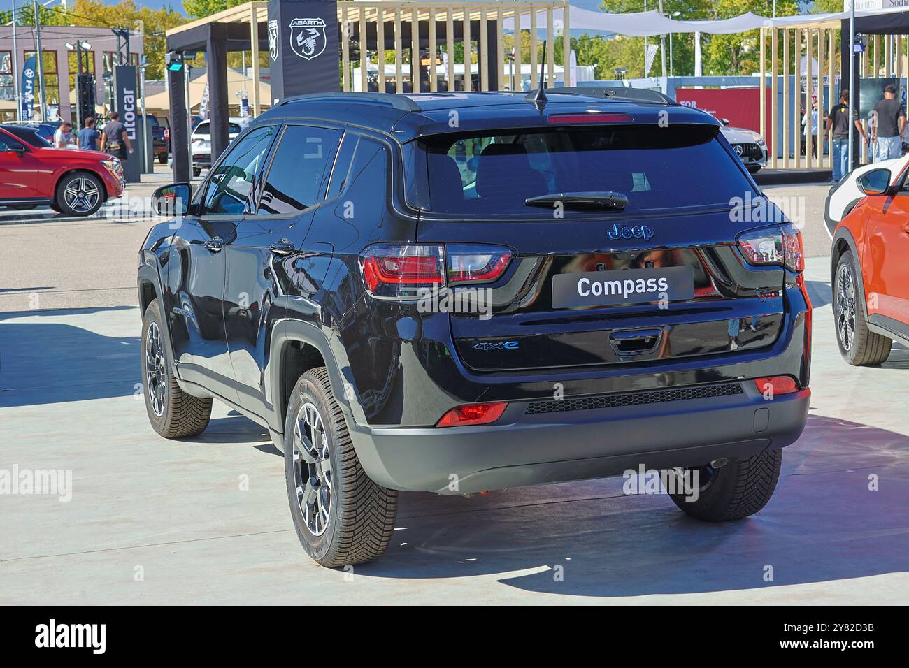 Modern suv car parked at a dealership, reflecting the surrounding ...