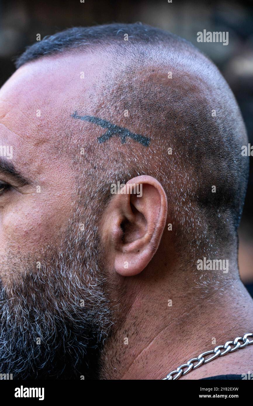 Beirut, Lebanon. 02nd Oct, 2024. A man seen with a tattoo of AK-47 or ...