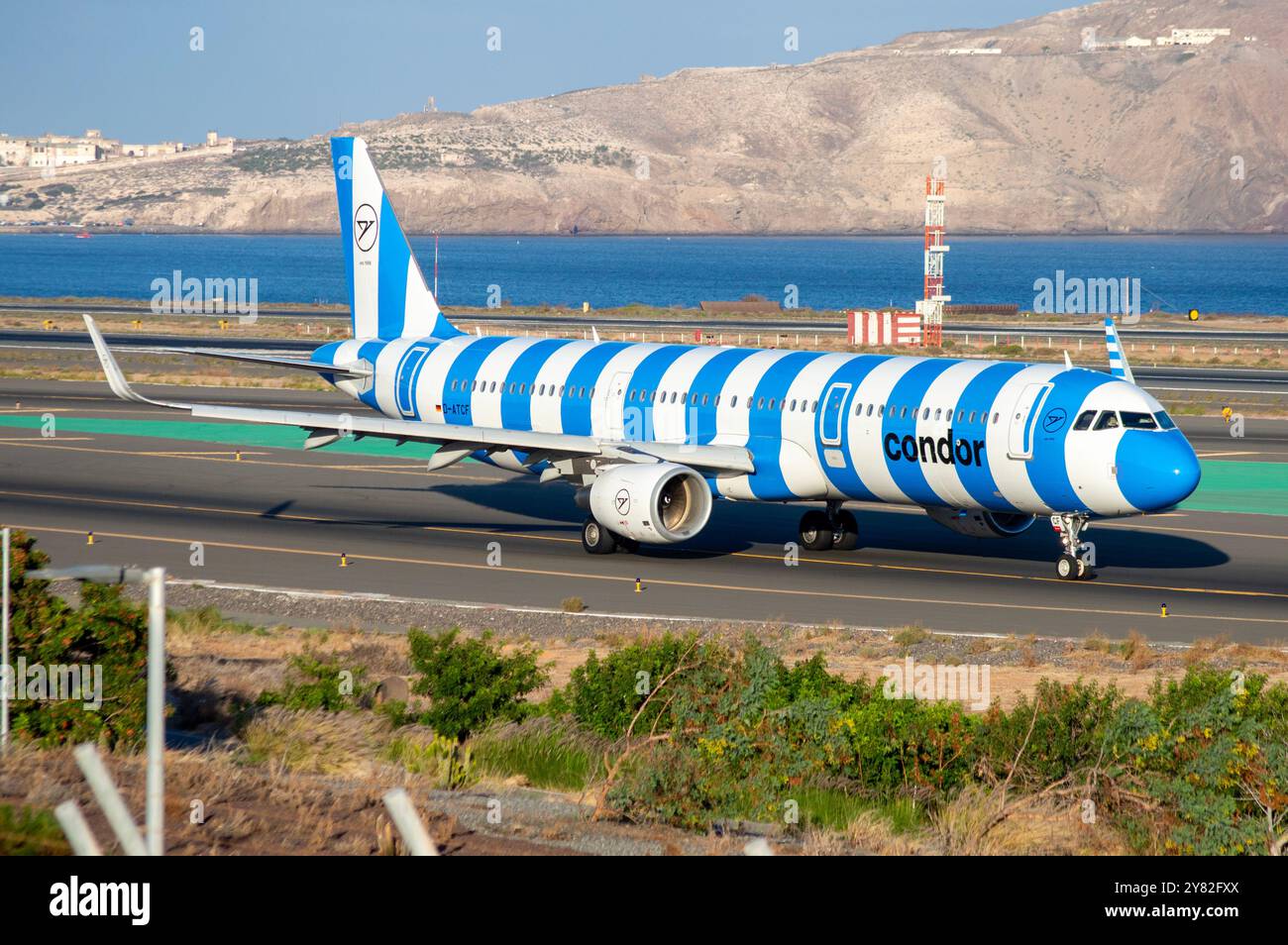Airbus A321 airliner of the Condor airline with special blue stripe ...