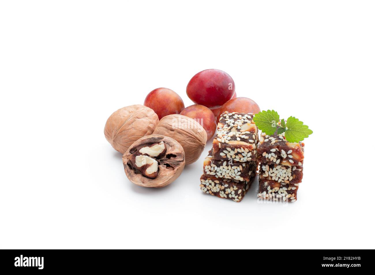 Homemade plum and nut pastila isolated on white background Stock Photo ...
