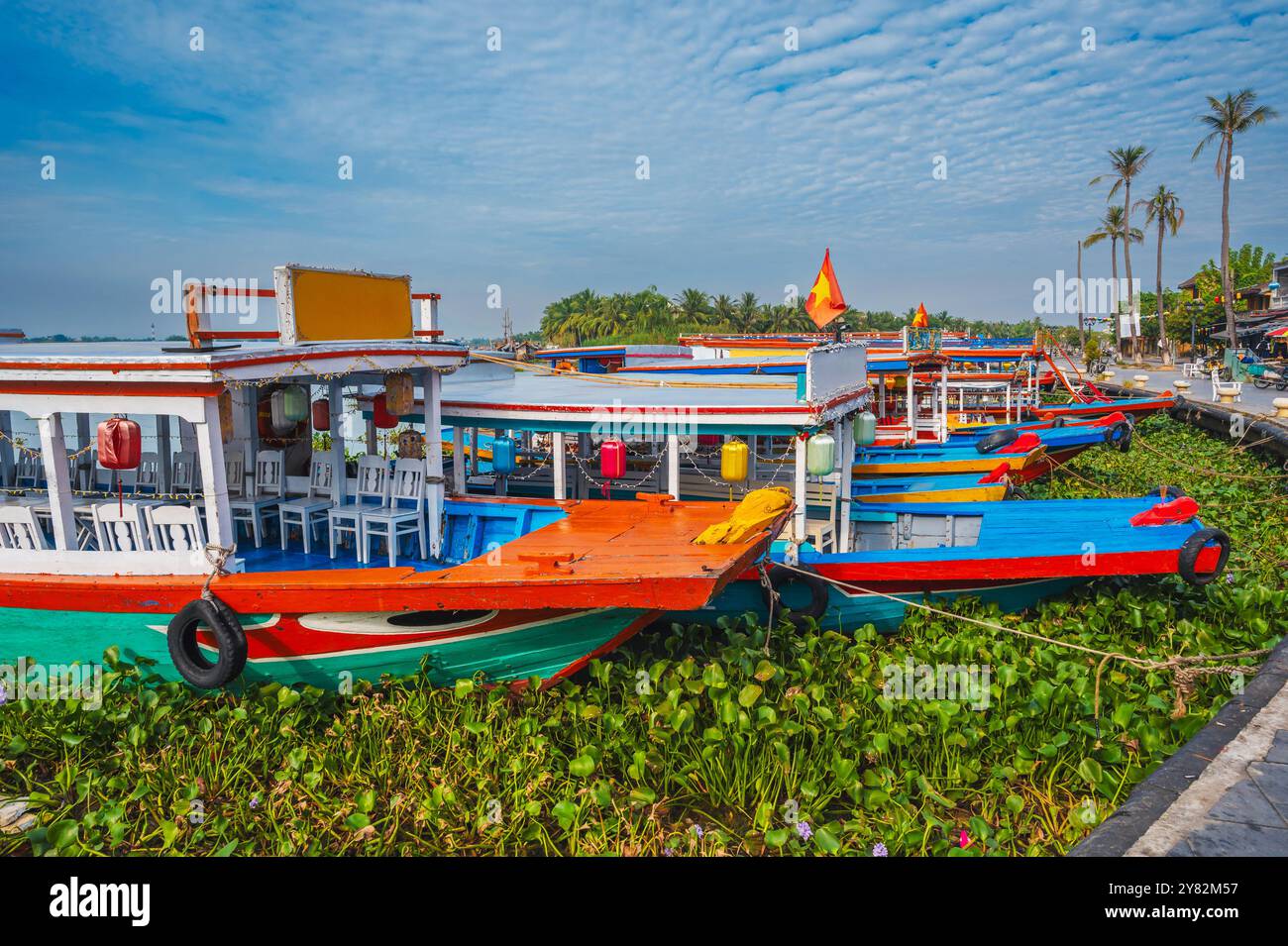 Traditional wooden Vietnamese boats on the Thu bon river in the old ...