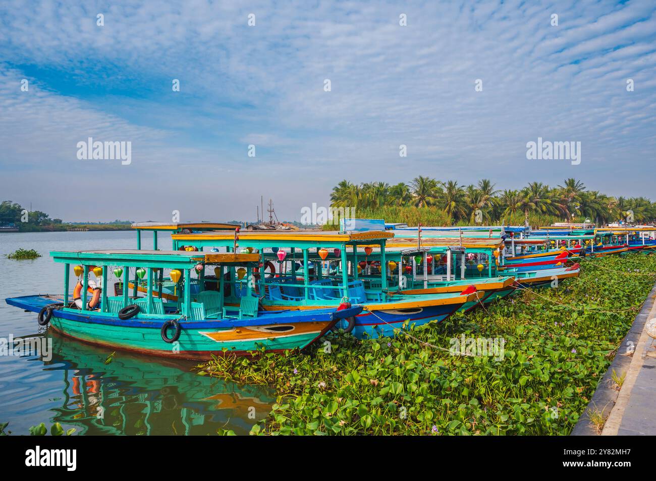 Traditional wooden Vietnamese boats on the Thu bon river in the old ...