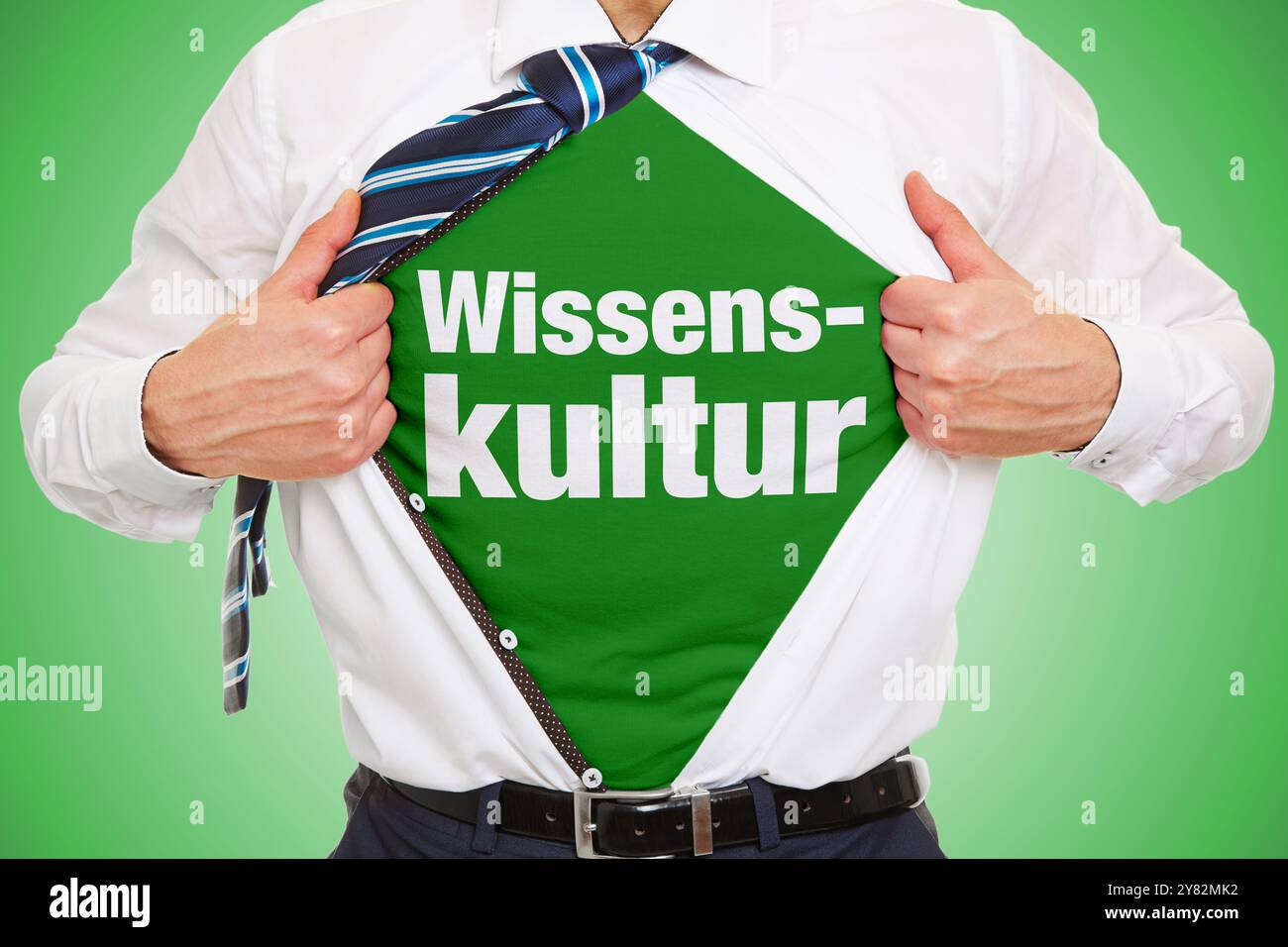 Businessman shows lettering Wissenskultur (German for: “knowledge ...