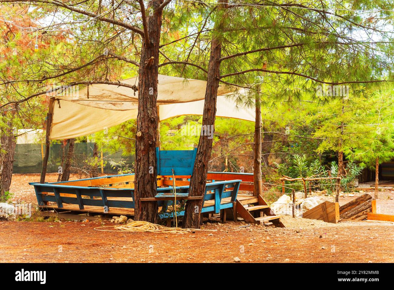 wooden gazebo with awning made using wooden in forest Stock Photo - Alamy