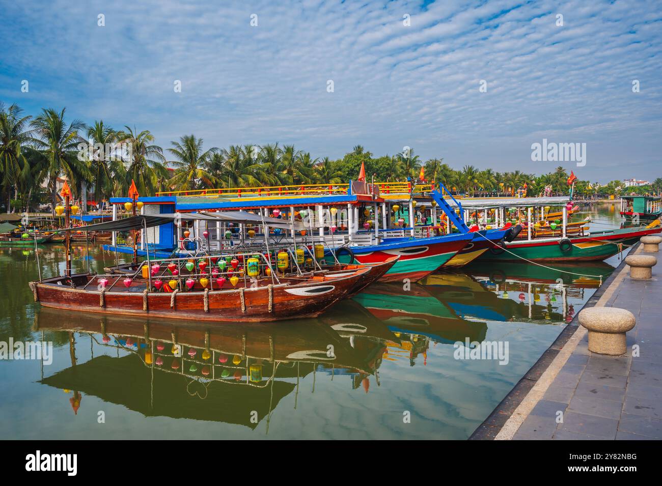 Traditional Vietnamese boats on Thu bon river in the old town in Hoi An ...