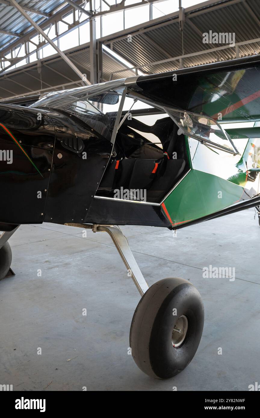 Small private lightweight propeller airplane in hangar, closeup photo ...