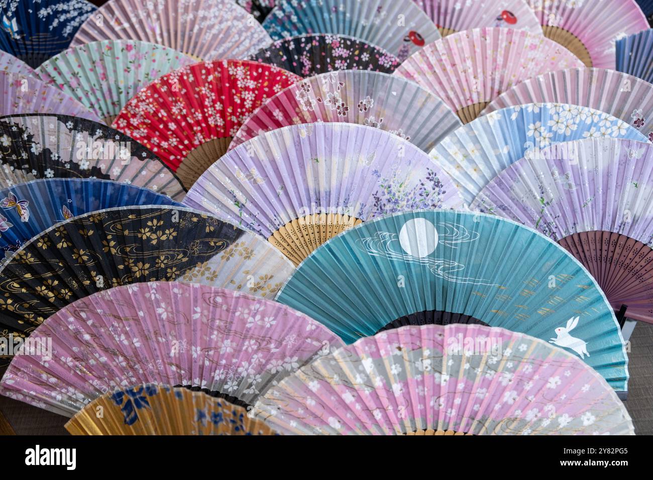 Oriental paper hand fans collection background. Japanese souvenir store ...