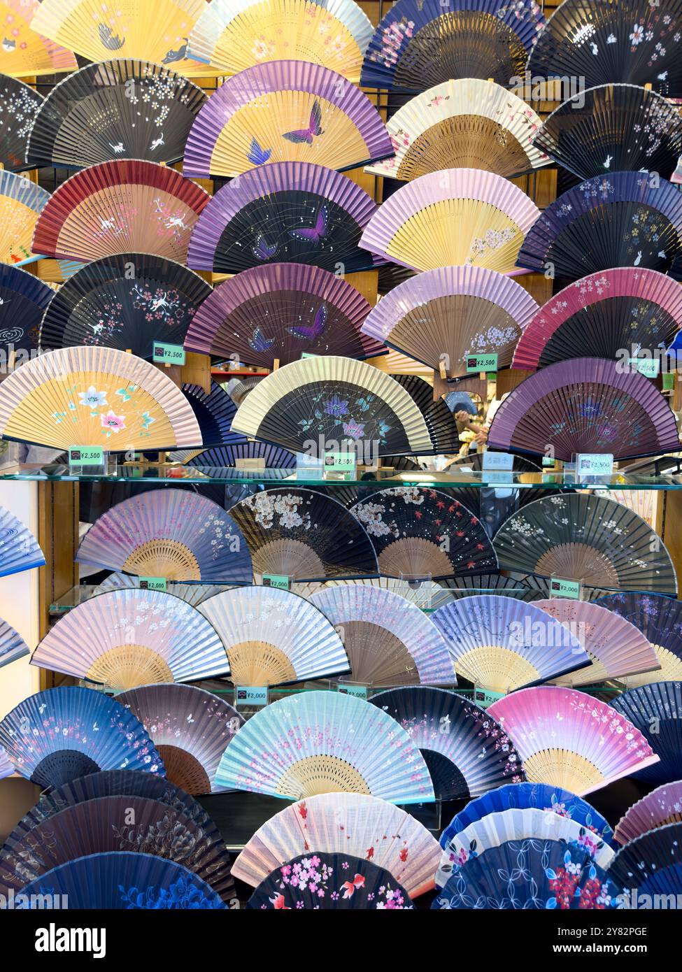 Oriental paper hand fans collection background. Japanese souvenir store ...