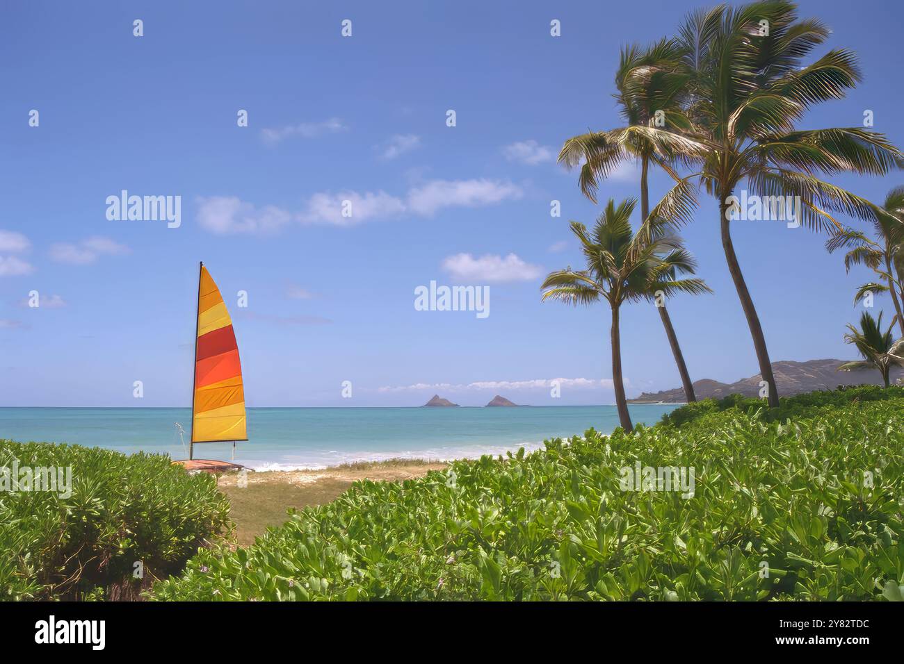 A sailboat on the beautiful sandy Kailua Beach Oahu Hawaii and on the ...