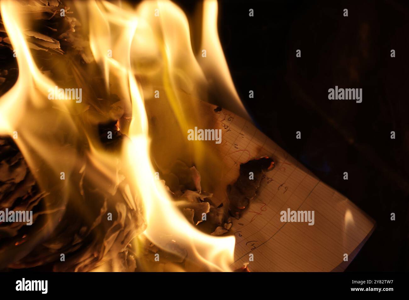 A document burning in flaming fire Stock Photo - Alamy
