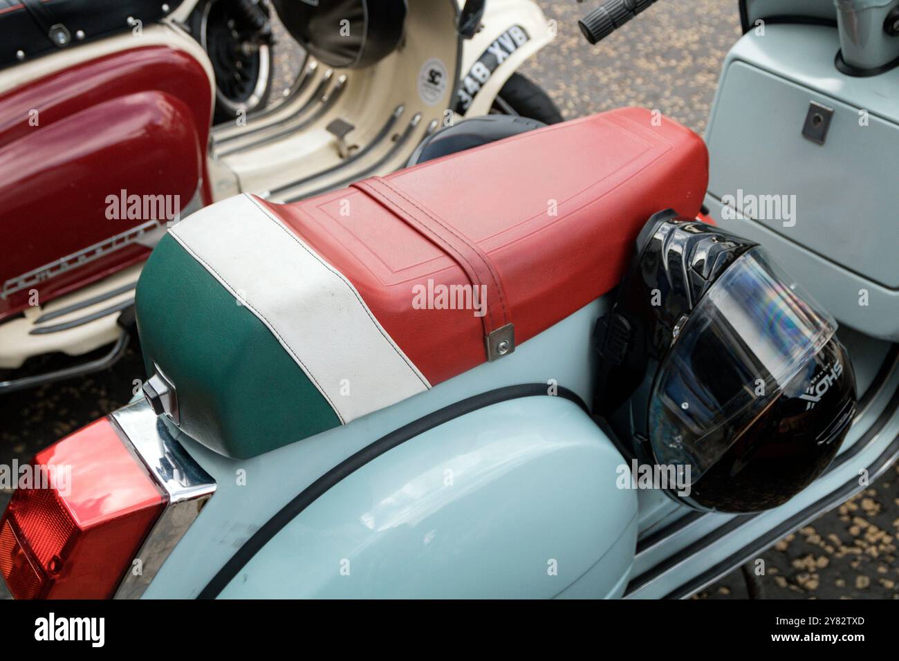 Scooter with the seat in the colours of the Italian flag. Ribble Valley ...