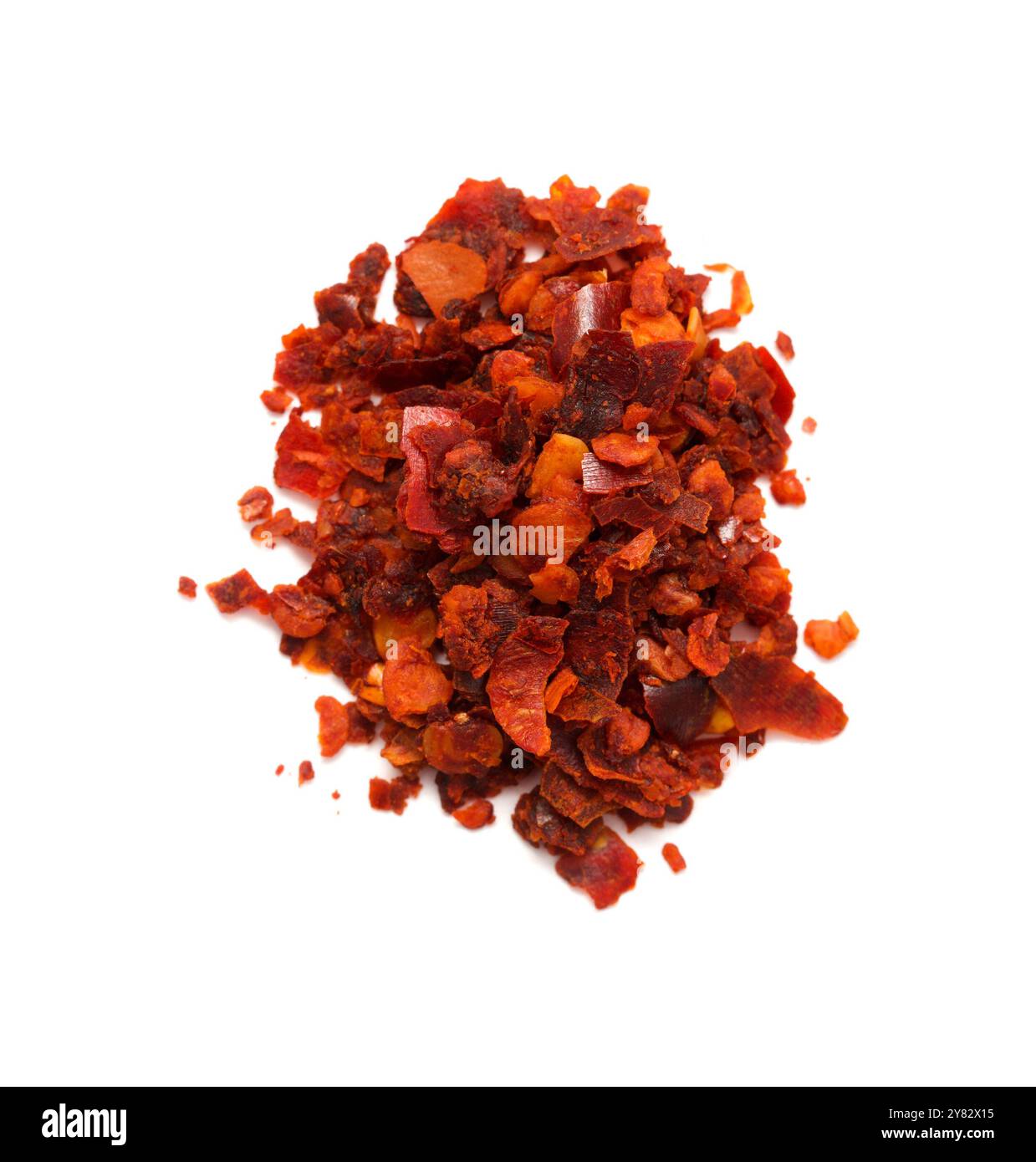 red pepper flakes isolated on white background Stock Photo - Alamy