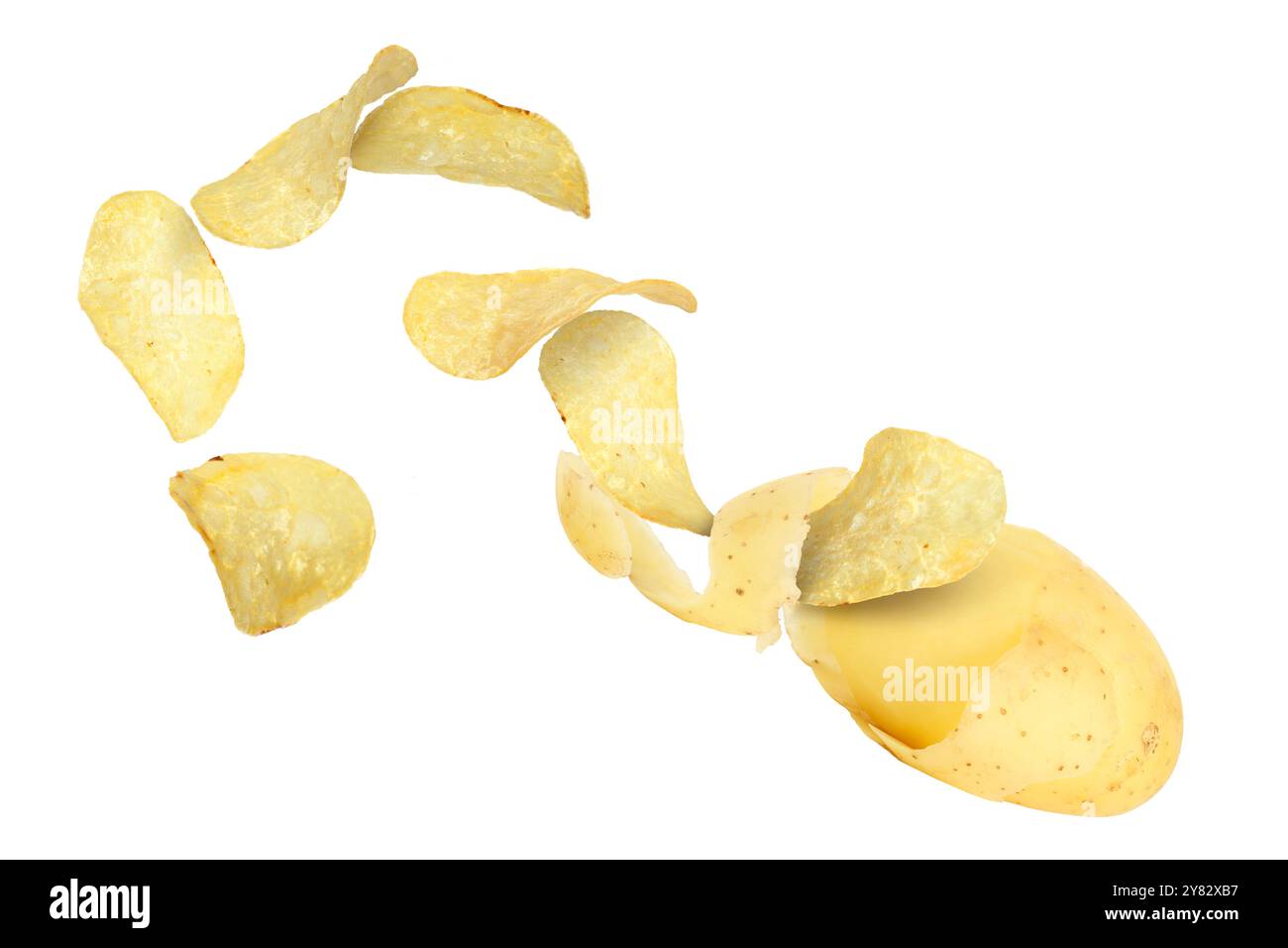 Raw potato turning into tasty crispy chips in air on white background ...
