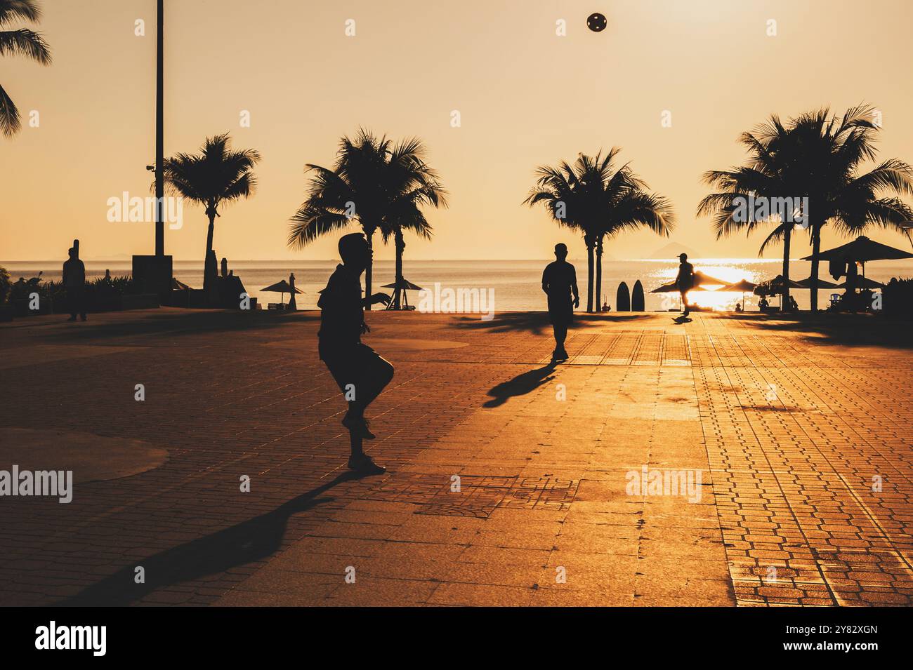 silhouettes of male players playing traditional football sepak takraw ...