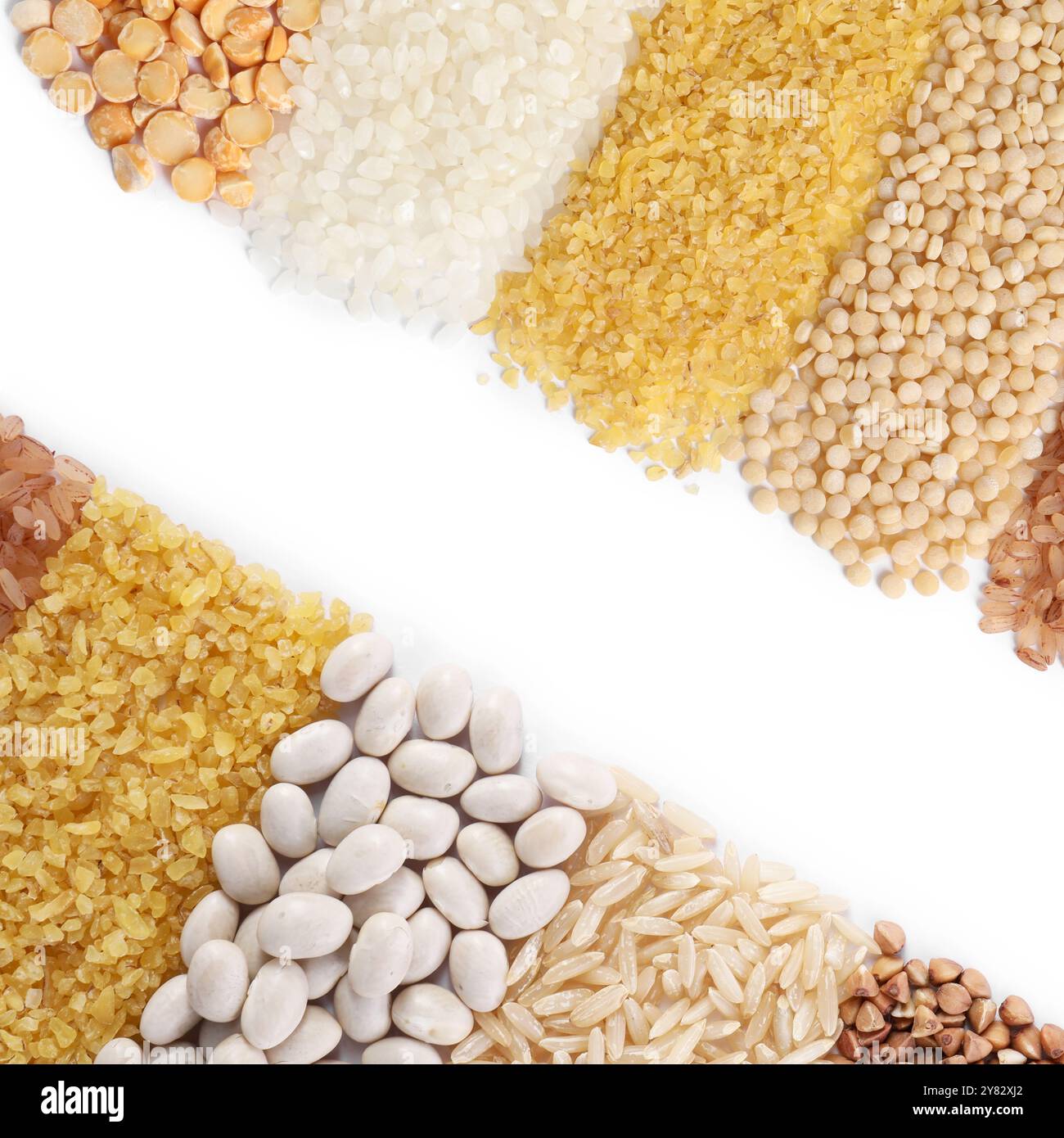 Different cereal grains and beans on white background, top view ...