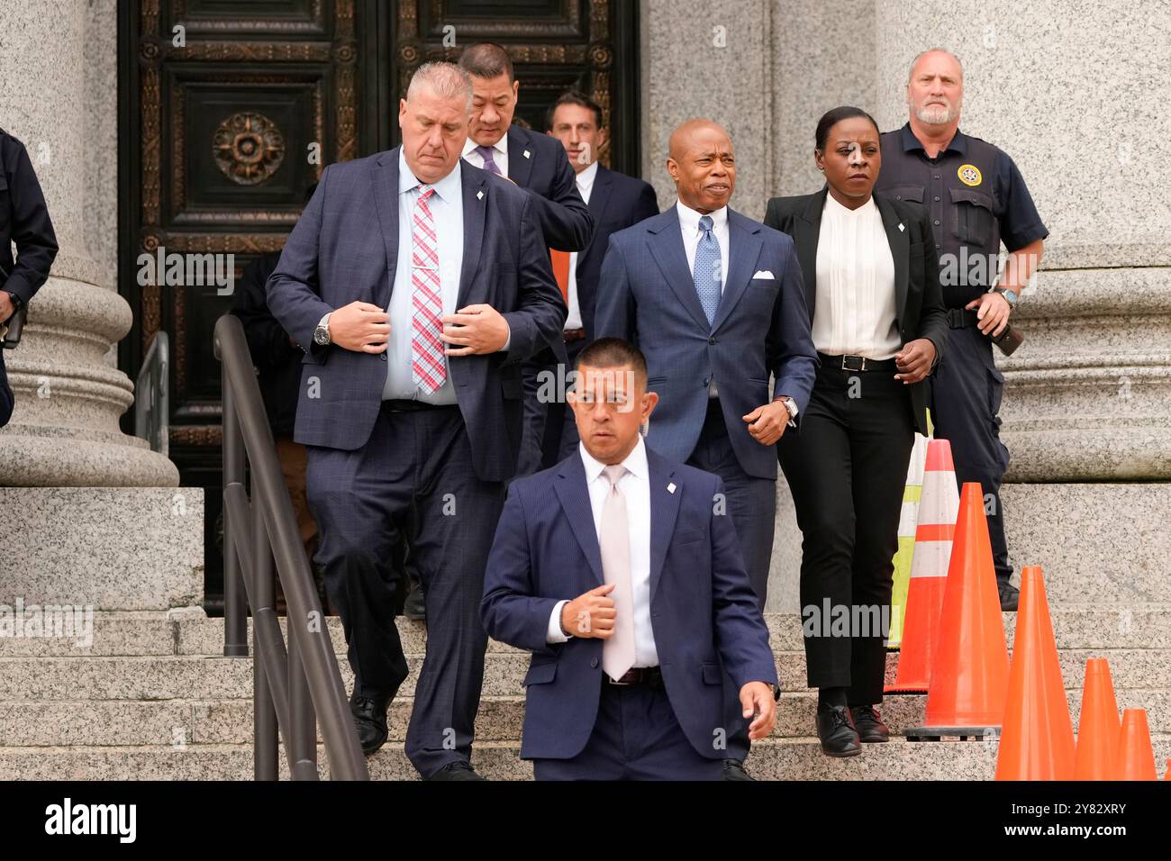 New York City Mayor Eric Adams, center, leaves the courthouse in New ...