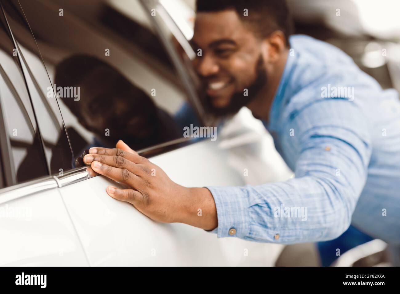 Happy Black Guy Touching His New Car In Dealership Store Stock Photo ...