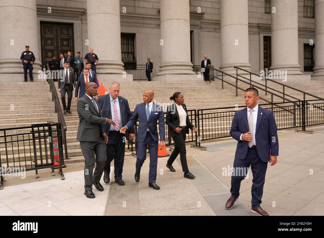 New York City Mayor Eric Adams, center, leaves the courthouse in New ...