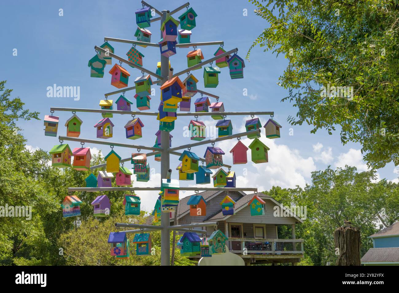 Kemah, Texas, USA - June 21, 2024: Brightly painted bird house hang ...