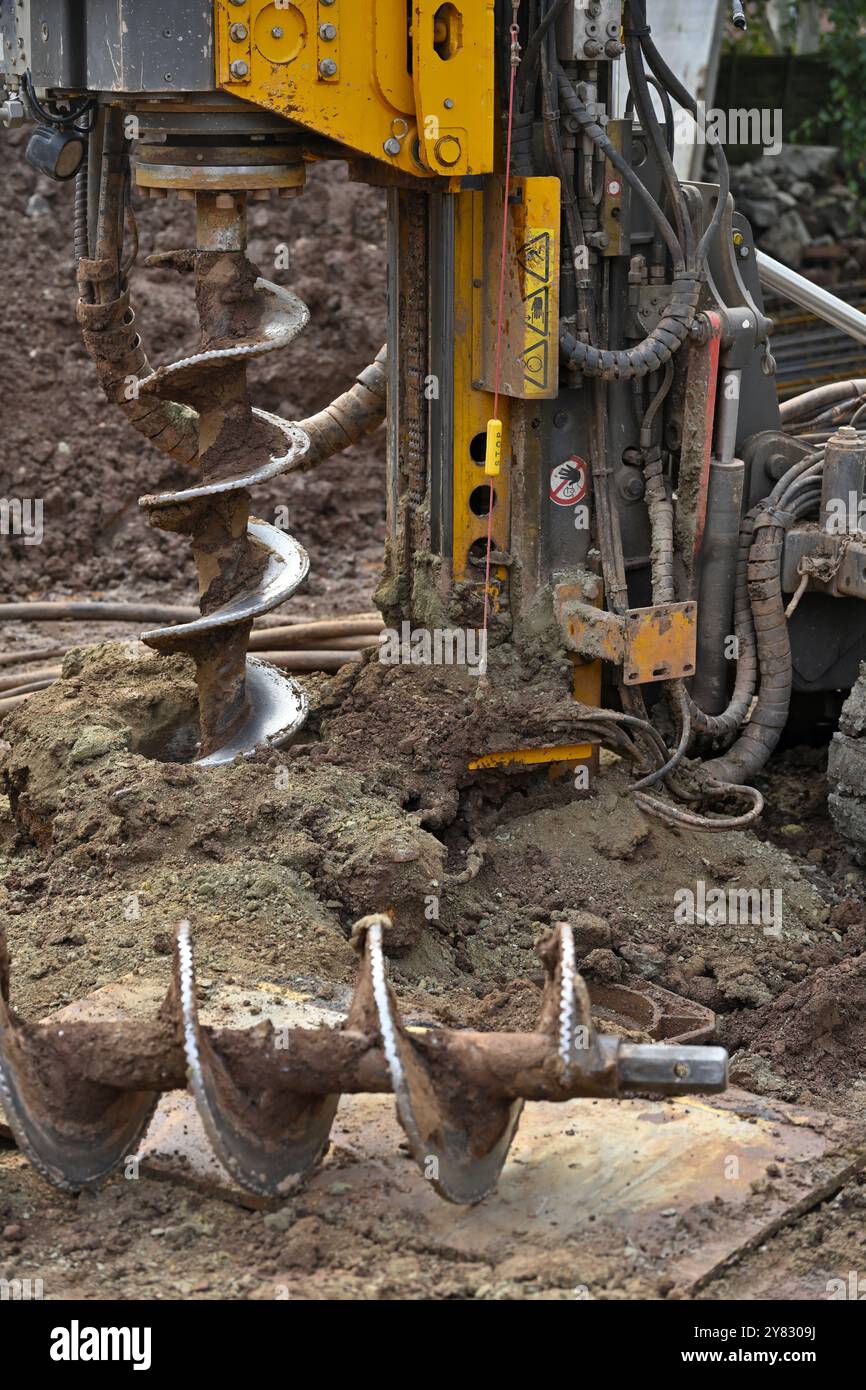 Auger pile drilling machine drilling hole in clay soil on domestic ...