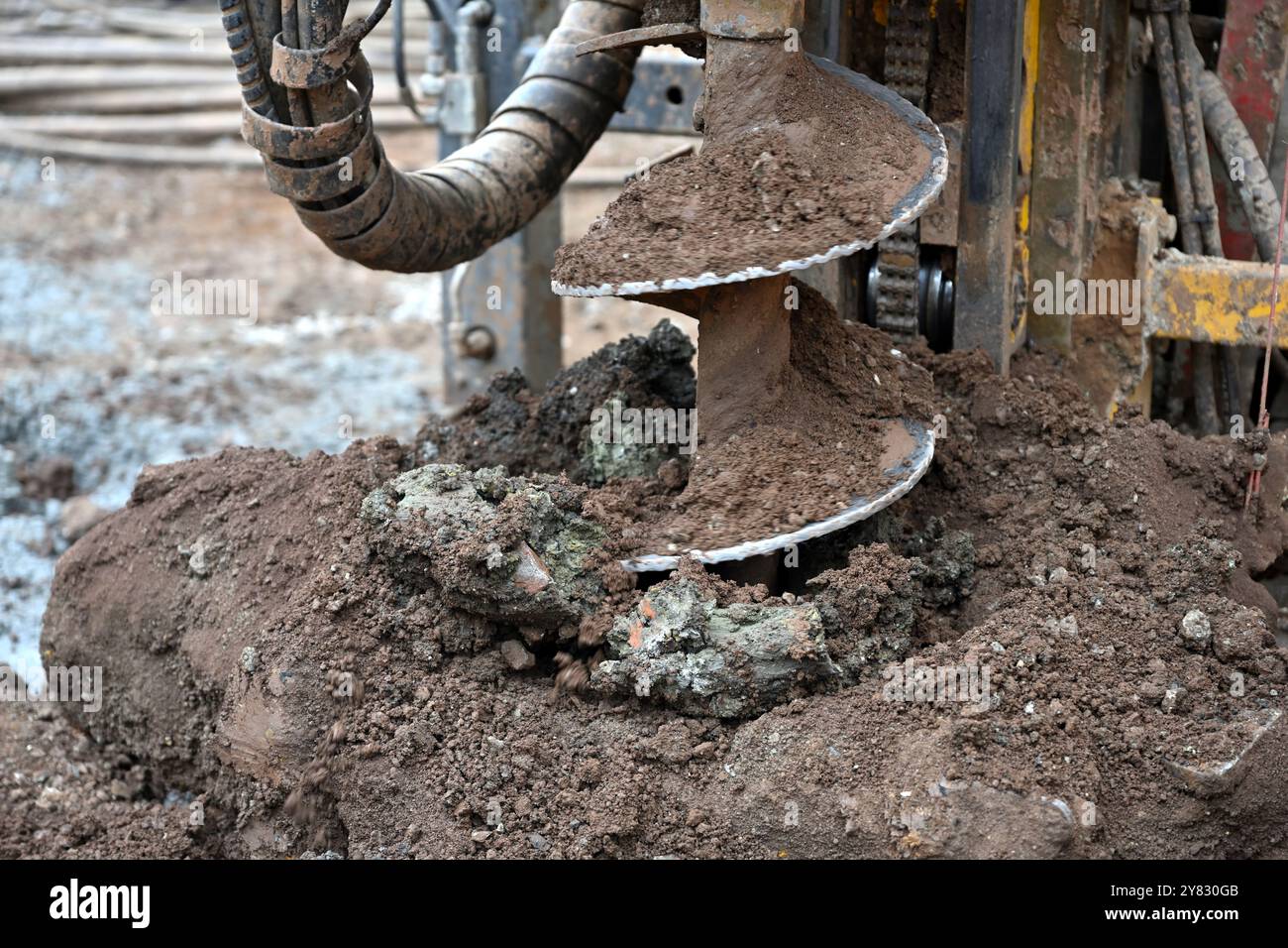 Auger pile drilling machine drilling hole in clay soil Stock Photo - Alamy