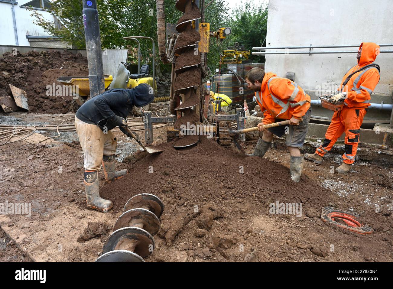 Auger pile drilling machine drilling hole in clay soil on domestic ...