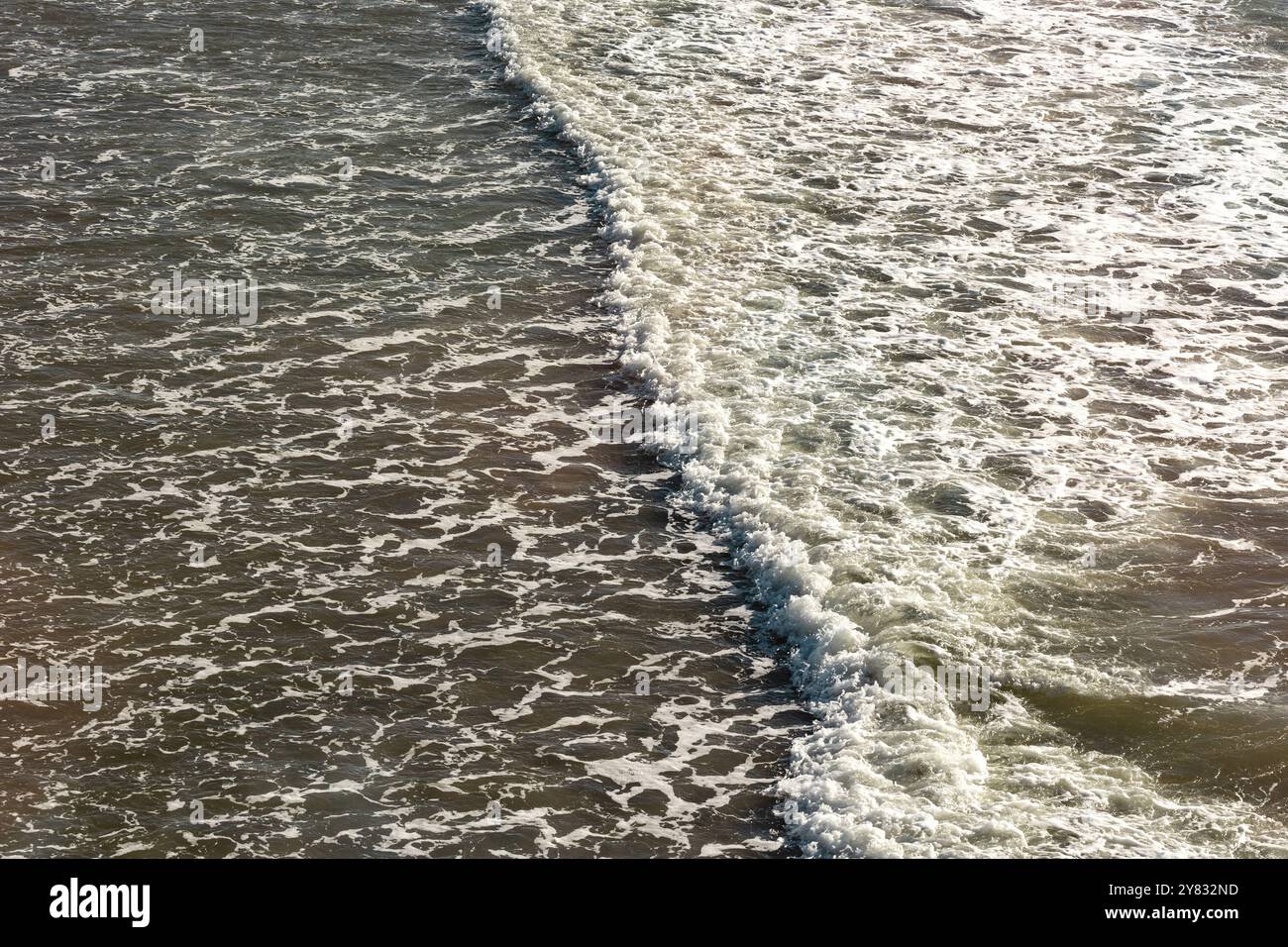 Surf on the beach Surf on the beach in Scheveningen during sunset. The ...