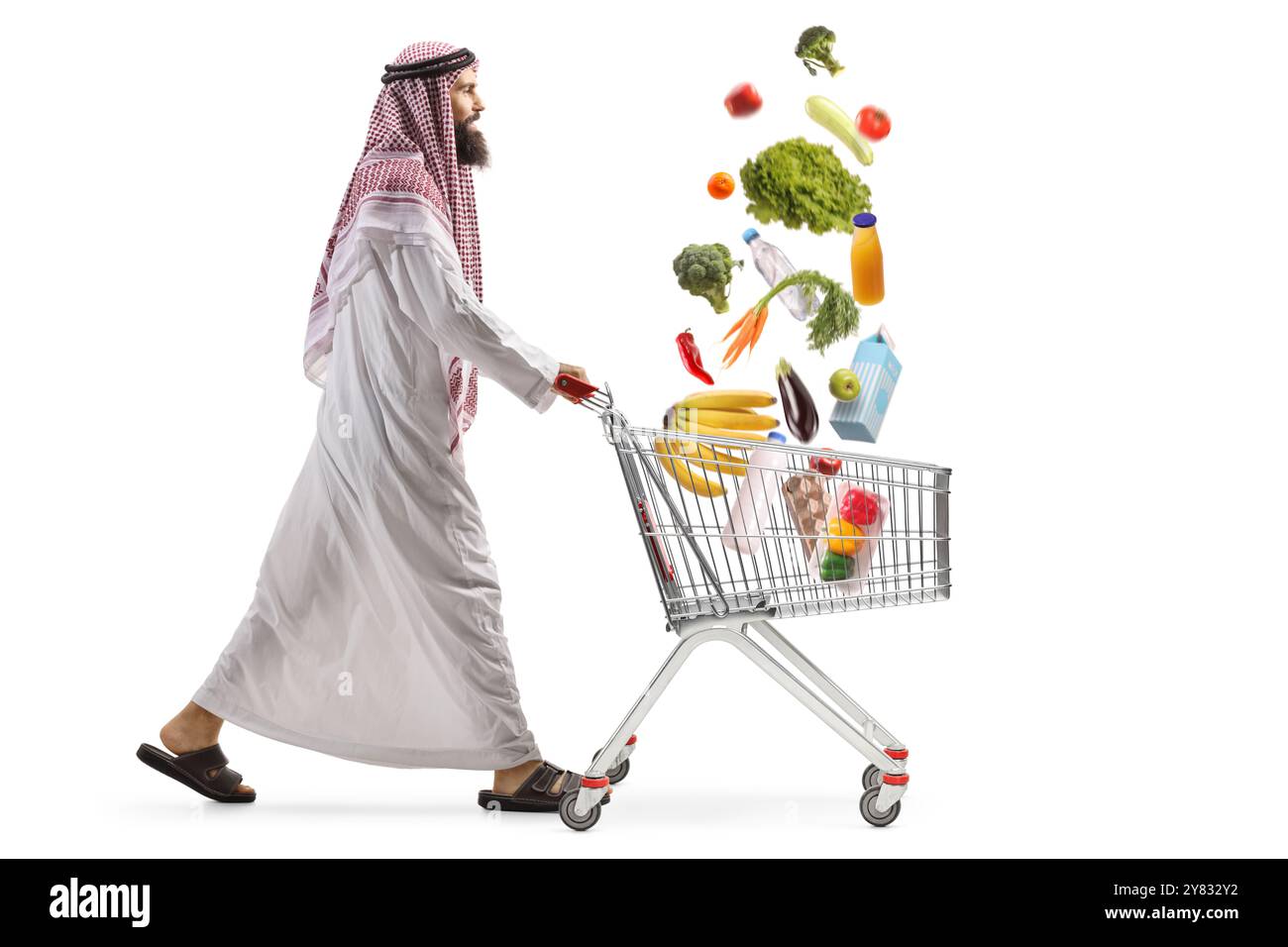 Full length profile shot of a saudi arab man pushing a shopping cart ...