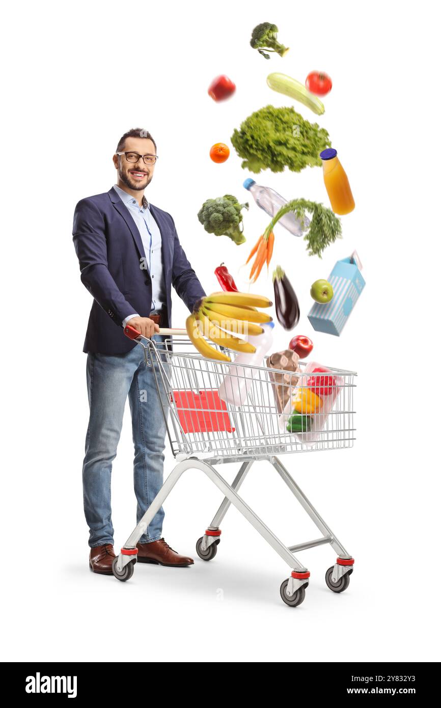 Man with a shopping cart, groceries falling in the cart isolated on ...