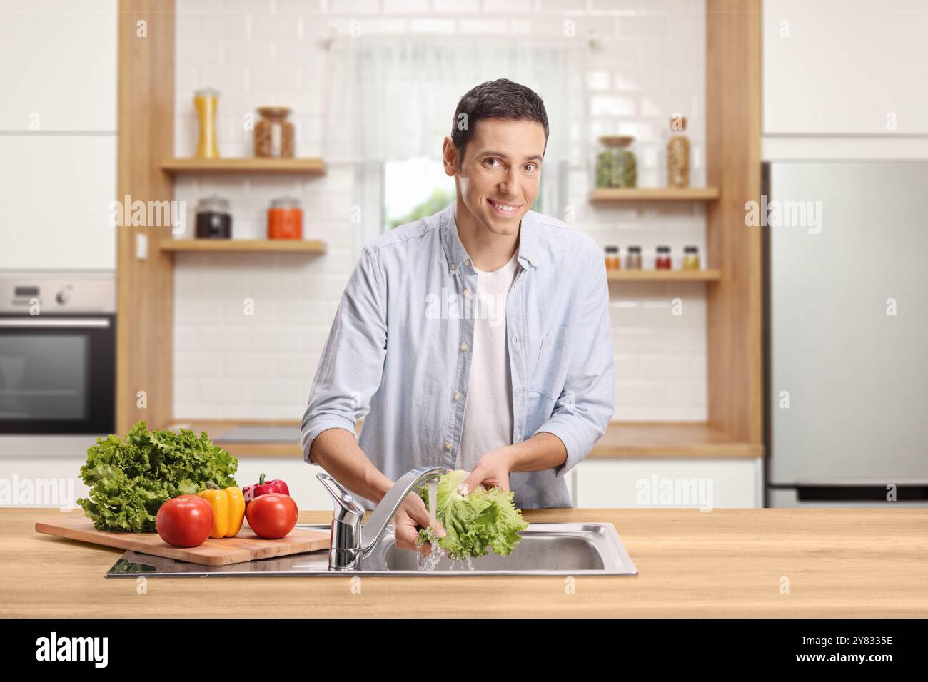 Washing vegetables in sink hi-res stock photography and images - Alamy