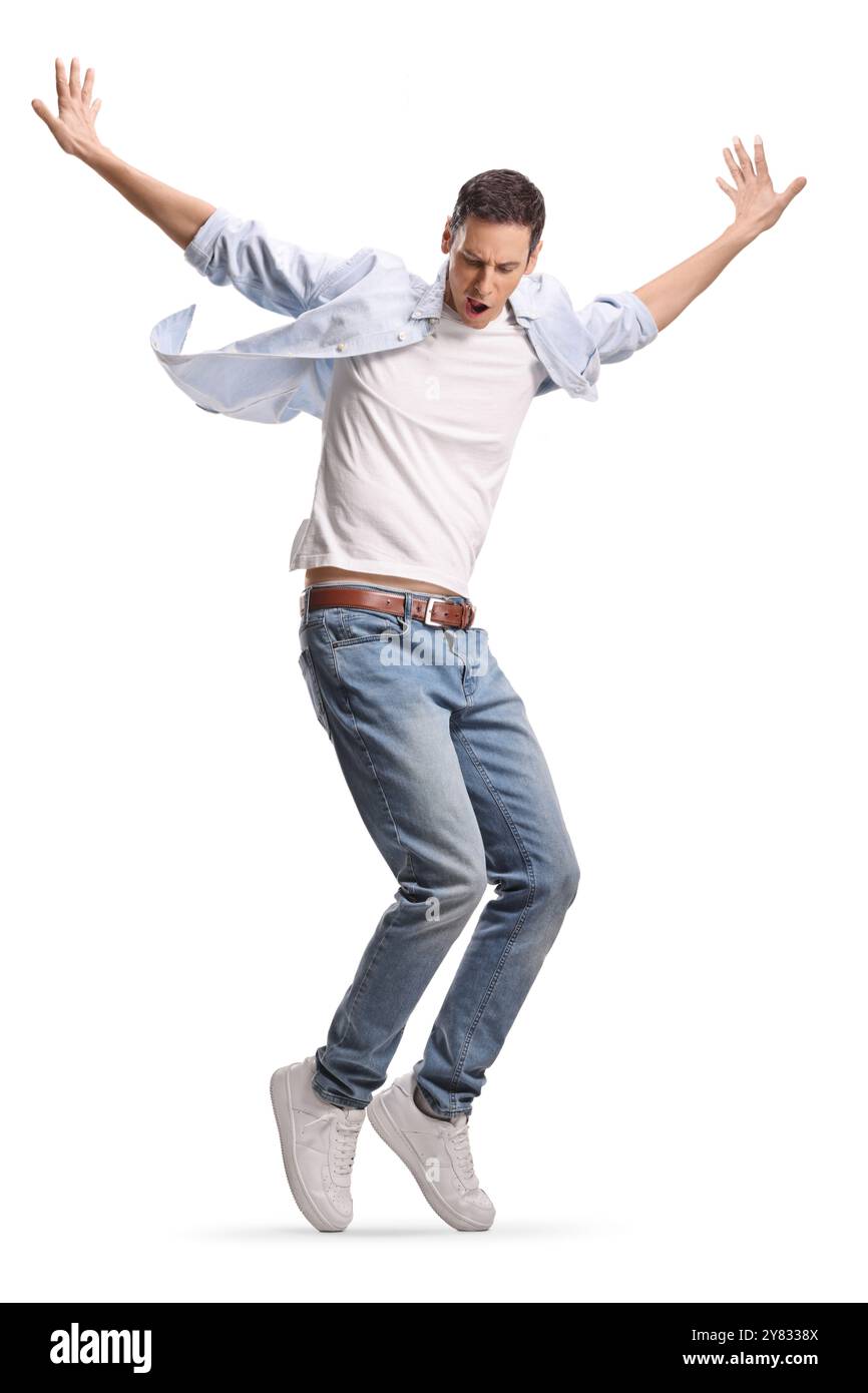 Young man dancing on tiptoes isolated on white background Stock Photo ...
