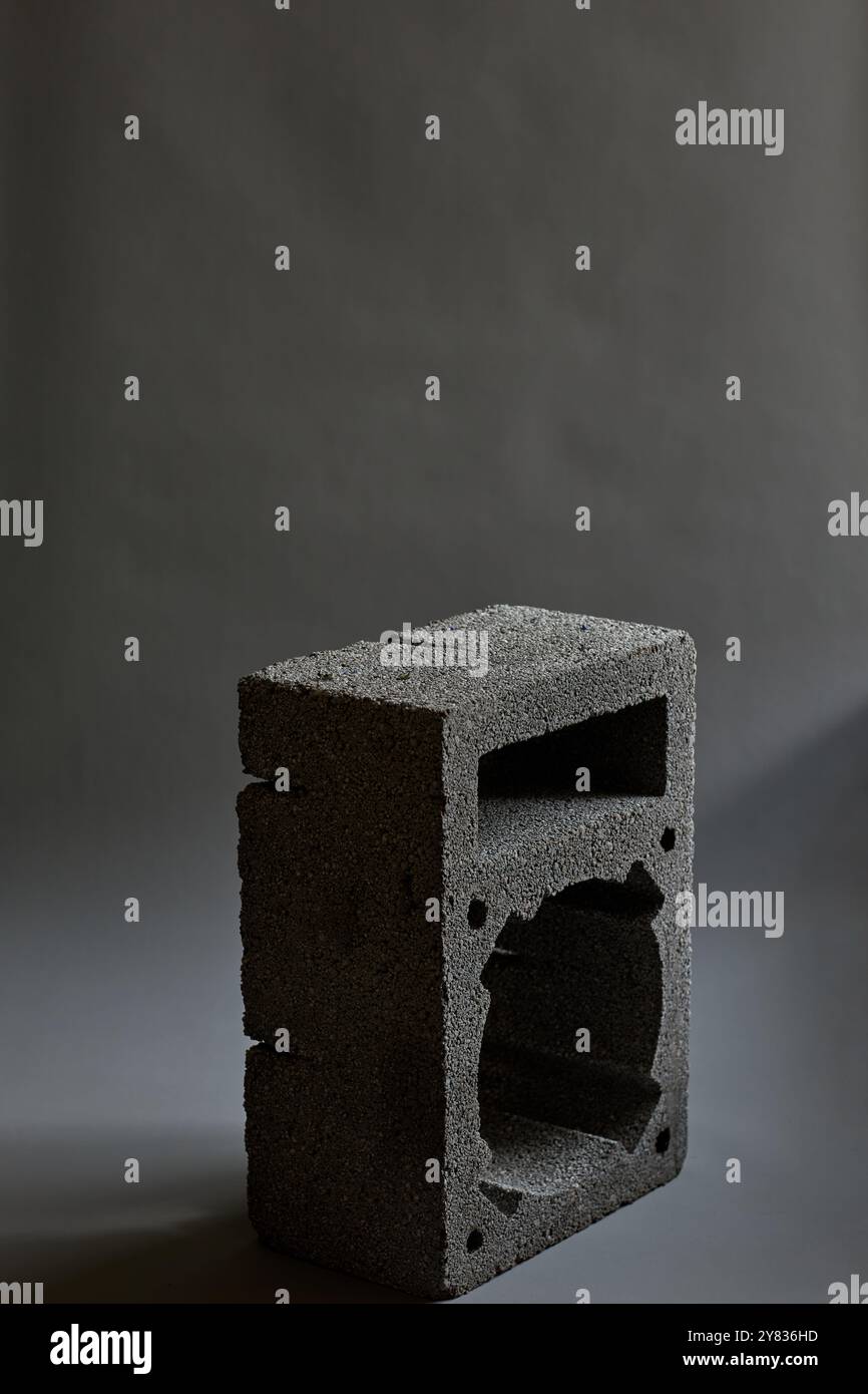 Minimal vertical shot of geometric concrete block with light and ...