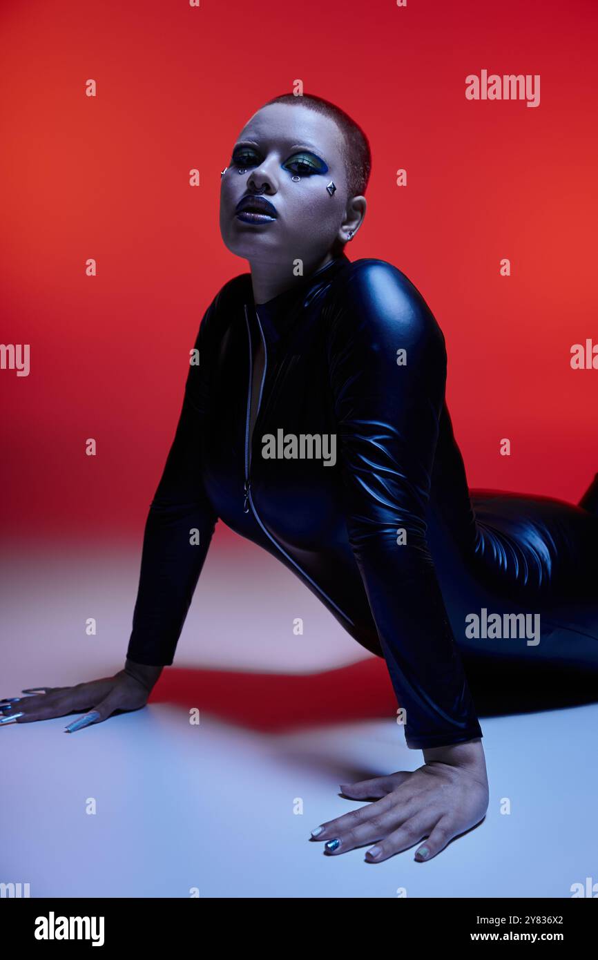 A confident young woman poses stylishly in a creative studio ...