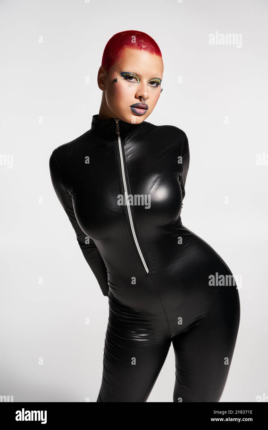 A young woman with pink hair and a striking outfit expresses her bold ...