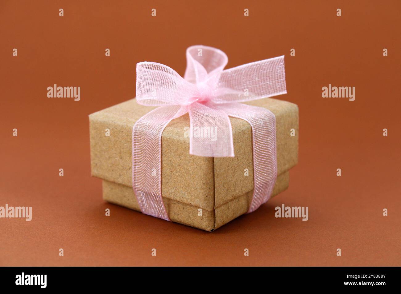 Square cardboard gift box with bow Stock Photo - Alamy