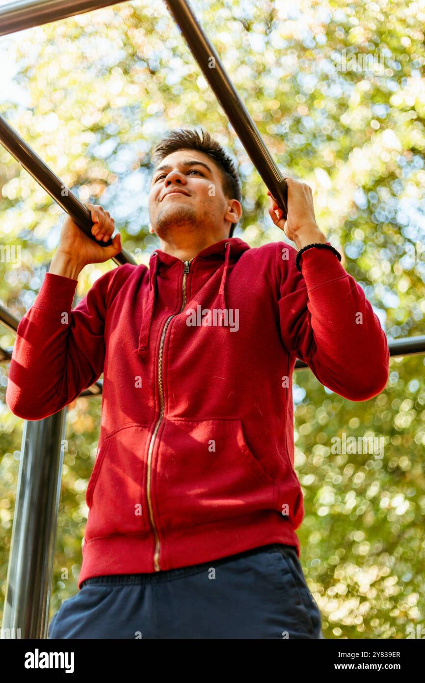 Sport man stretching at the park autumn, doing exercises.Handsome man ...