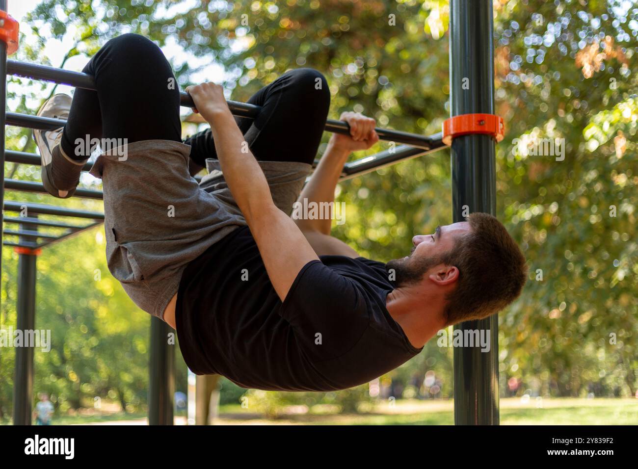 Sport man stretching at the park autumn, doing exercises.Handsome man ...