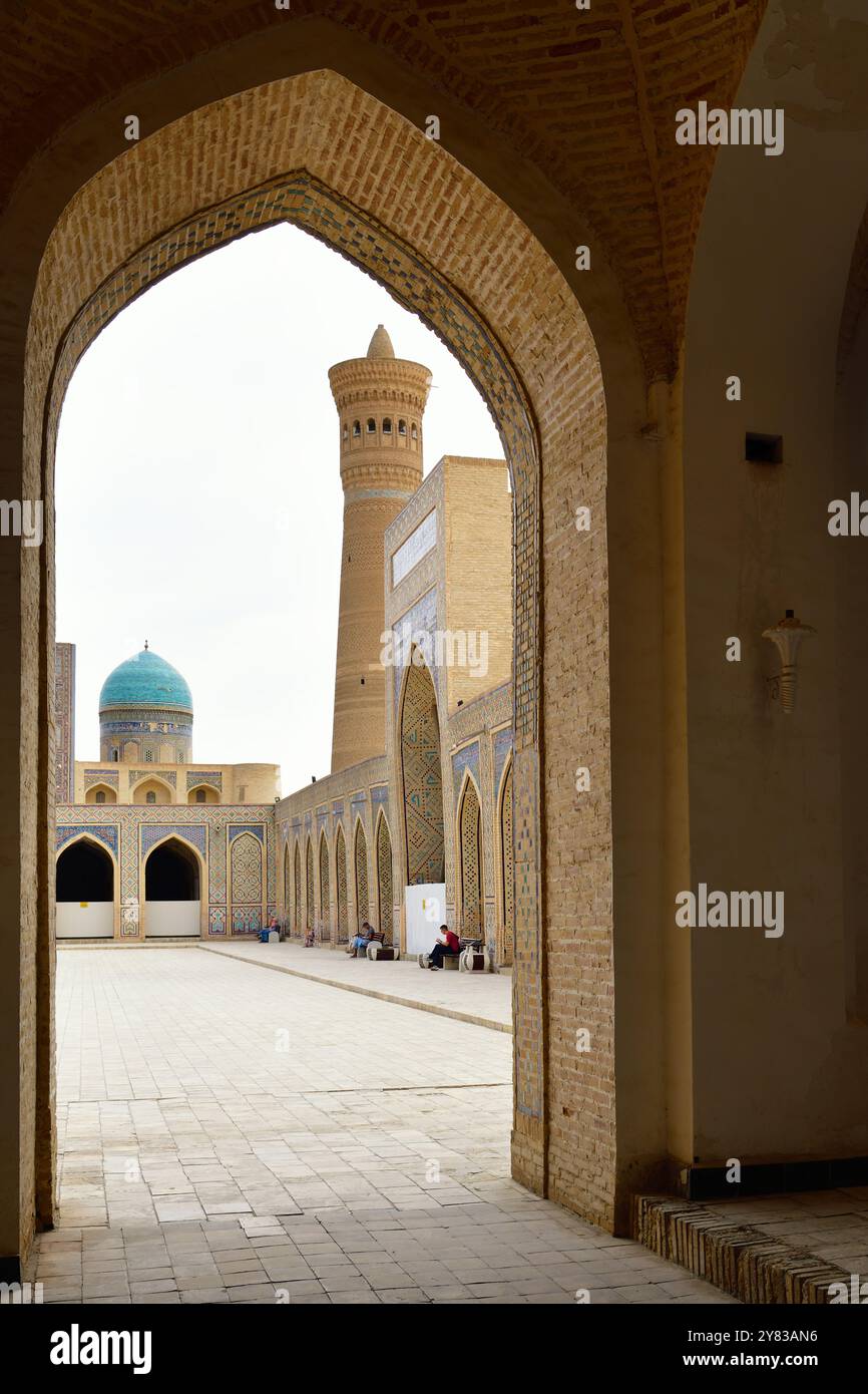 Inside the Kalon mosque, view from arch on square and minaret Stock ...