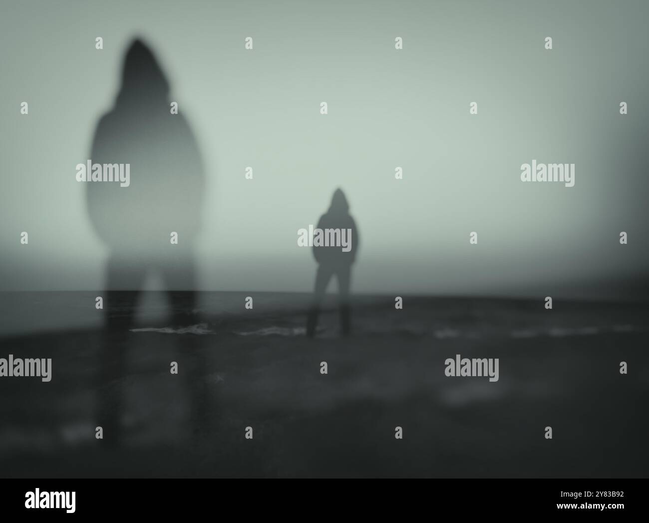 Surreal image of a person in silhouette watching another person by the ...