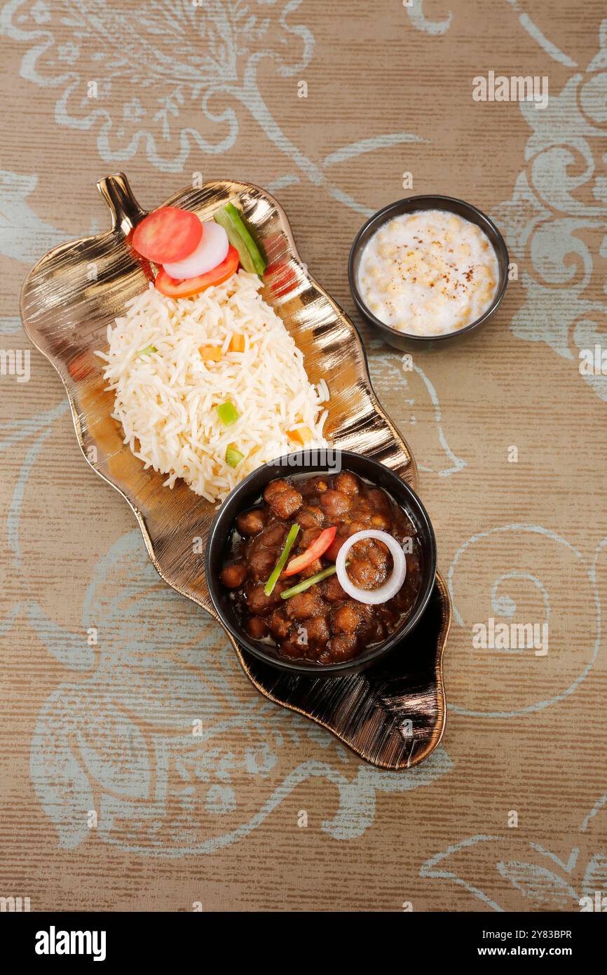Chole Chawal or Chana Masala With Veg Pulao,Raita, Indian dish Stock ...