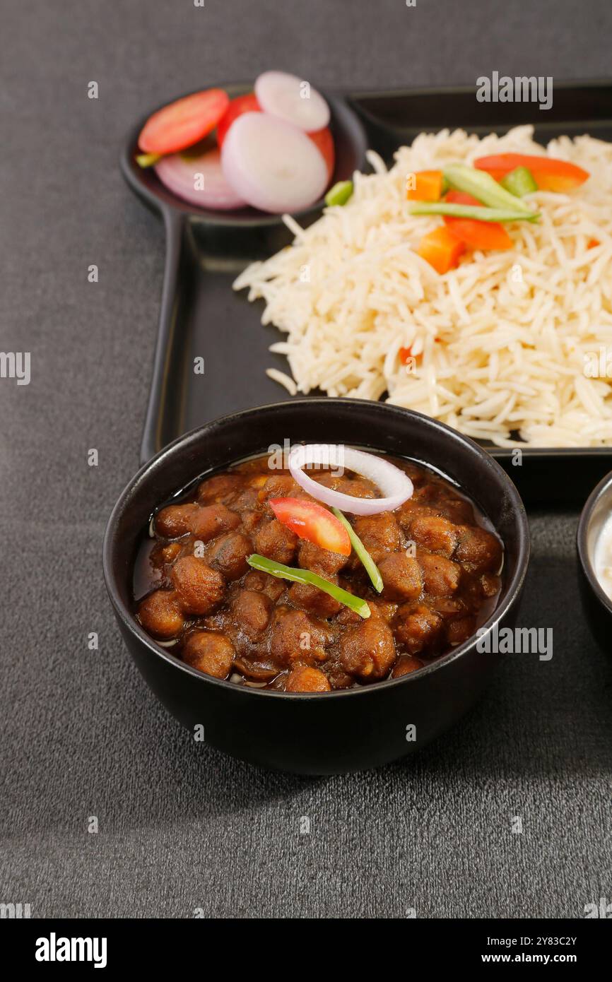 Chole Chawal or Chana Masala With Veg Pulao, Indian dish Stock Photo ...