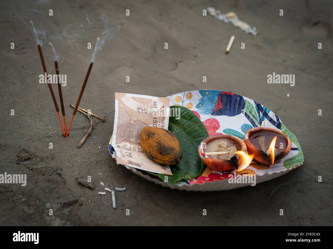 Hindu devotees perform the 'Tarpan' ritual during Mahalaya prayers ...