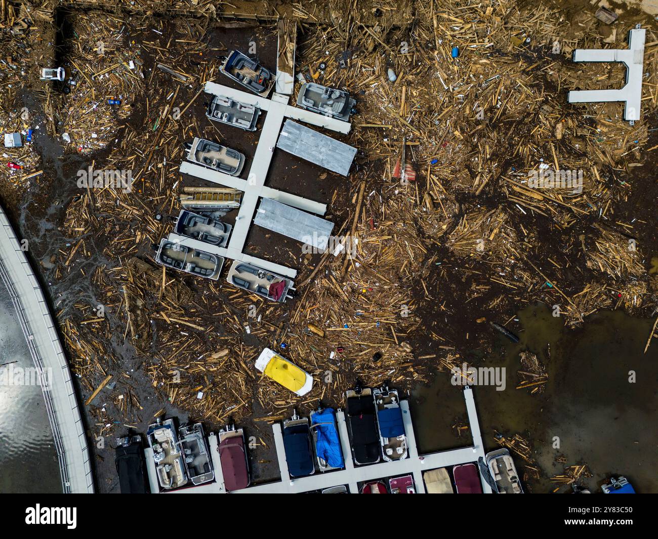 A marina is choked in debris in the aftermath of Hurricane Helene ...