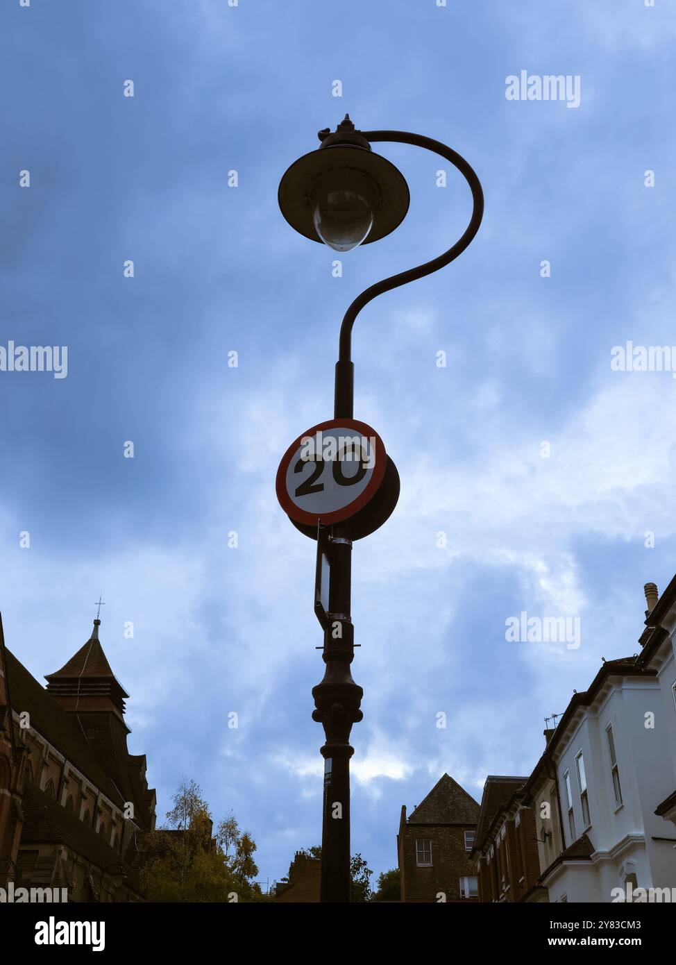 20 mph speed limit traffic sign on a post lamp in the UK Stock Photo ...